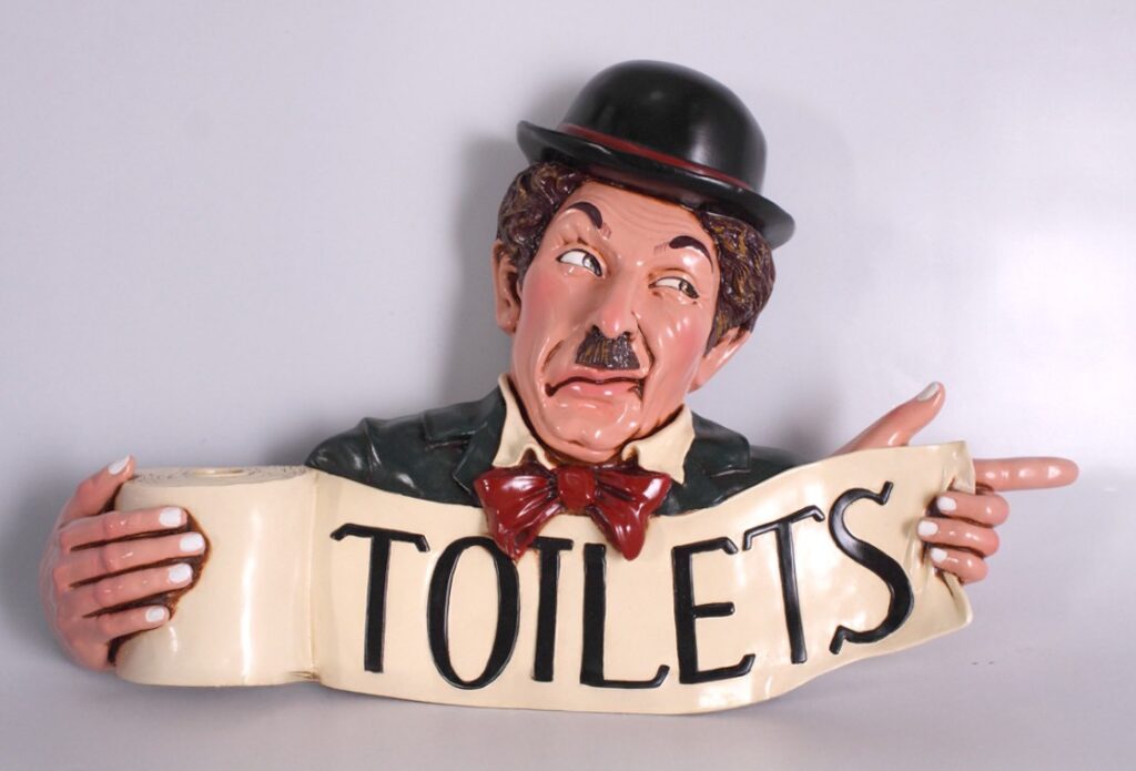 Comedian with toilet sign